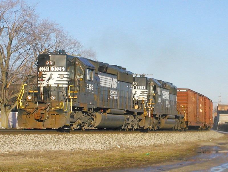 NS 3326 L71 catches the setting sun as it heads west